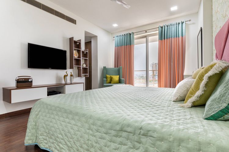 Spacious Bedroom Design With Floral Wallpaper | Livspace