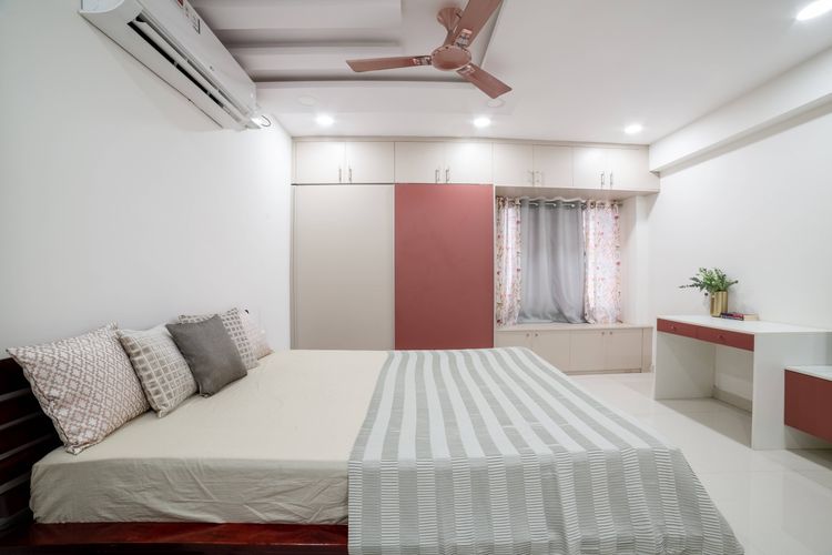 Master Bedroom Design With White And Peach Wardrobe With Loft Storage ...