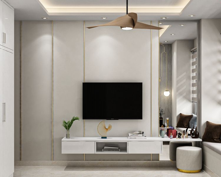 Compact TV Unit Design with Wall-Mounted Drawer and Golden T-Accent | Livspace