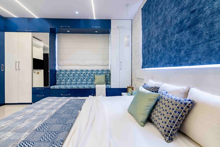 Spacious Bedroom Design With Pendant And Profile Lights | Livspace