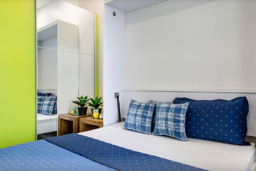 Compact Kids Room Design With Lime Green Wardrobe And Blue Bed ...