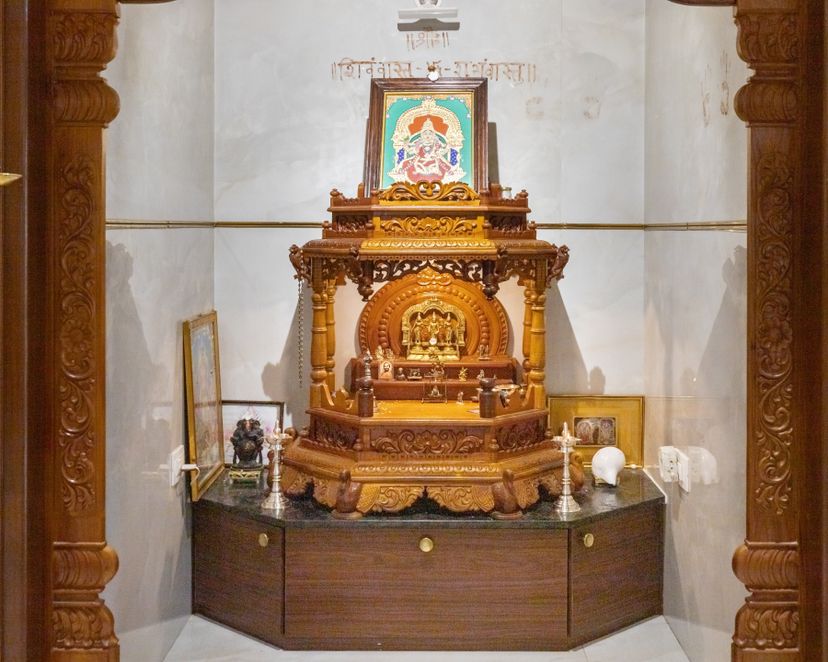 Floor-Mounted Pooja Unit Design With Wall Dado And Gold Inlays | Livspace