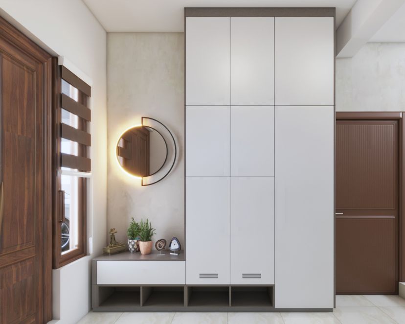 Spacious Foyer Design With Tall White Storage Unit And Wall-Mounted ...