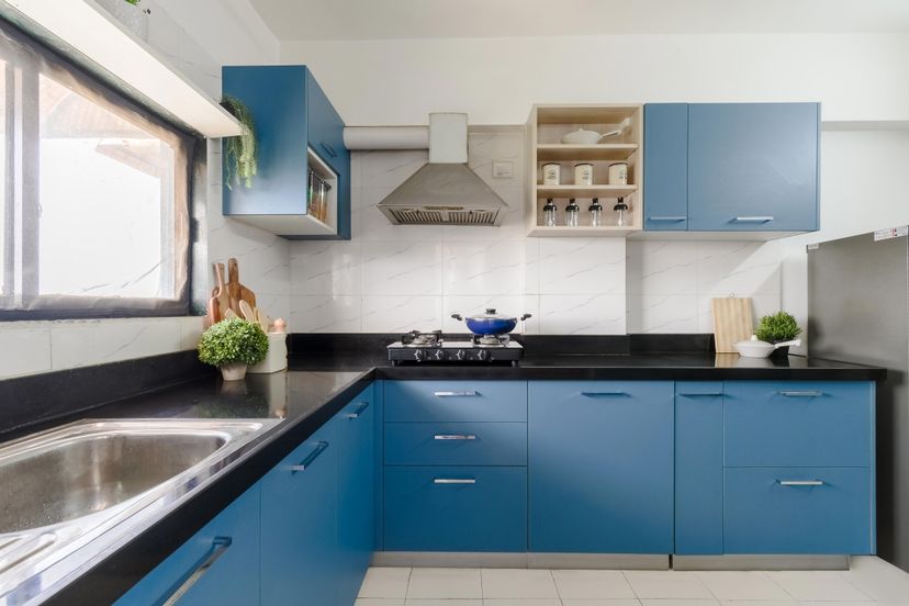 Aqua Blue Kitchen Design With Wall Storage | Livspace
